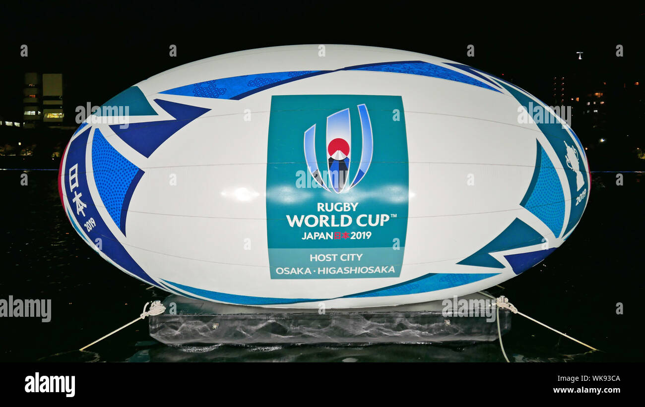 A giant rugby ball balloon floats on a river to promote the Rugby World ...