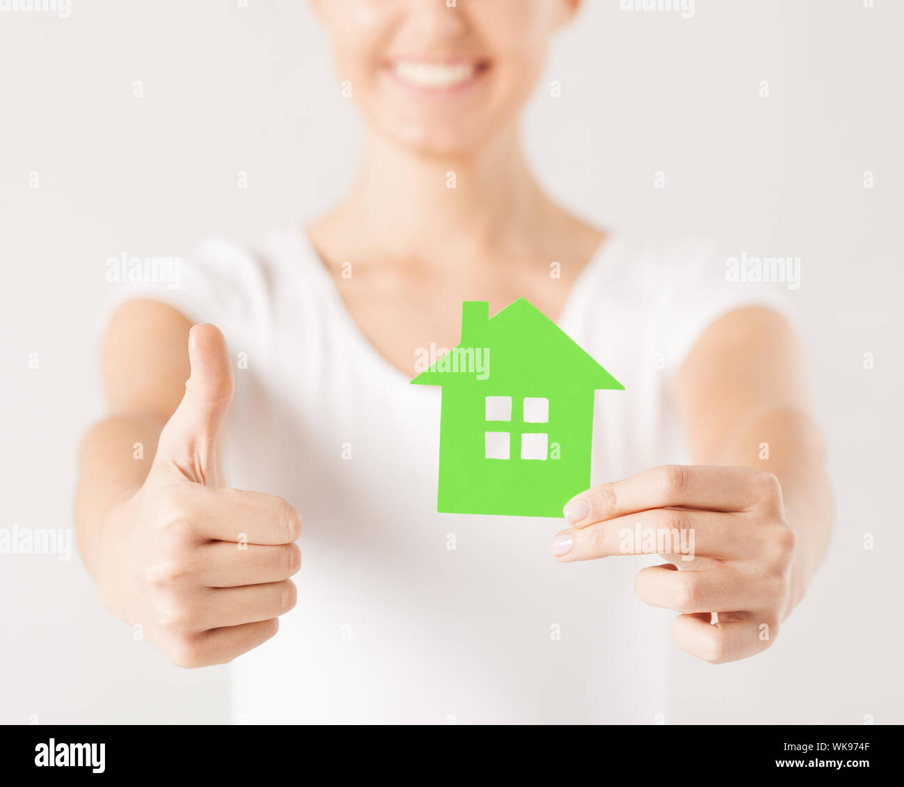 woman hands holding green house Stock Photo - Alamy