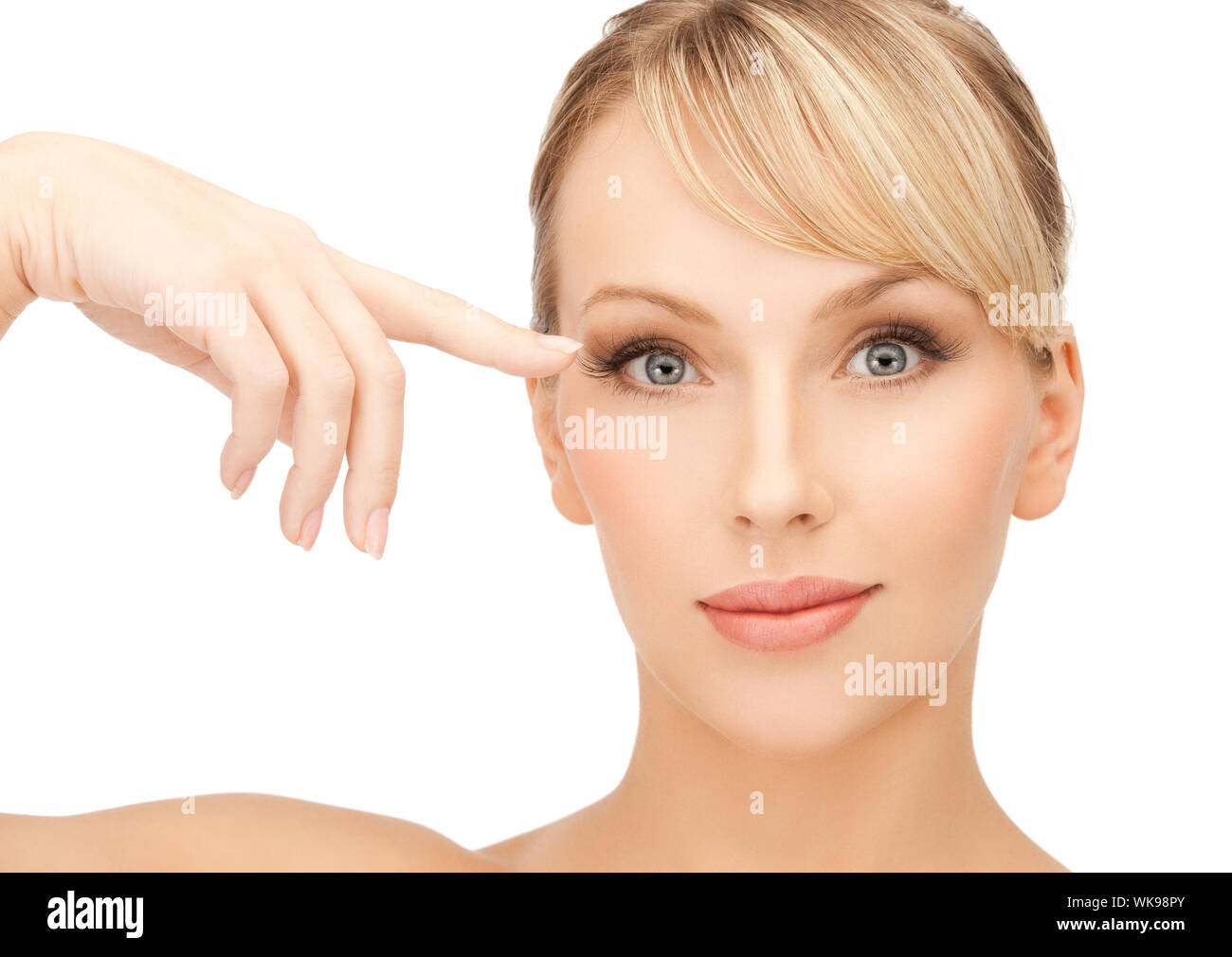 beautiful woman touching her eye area Stock Photo - Alamy