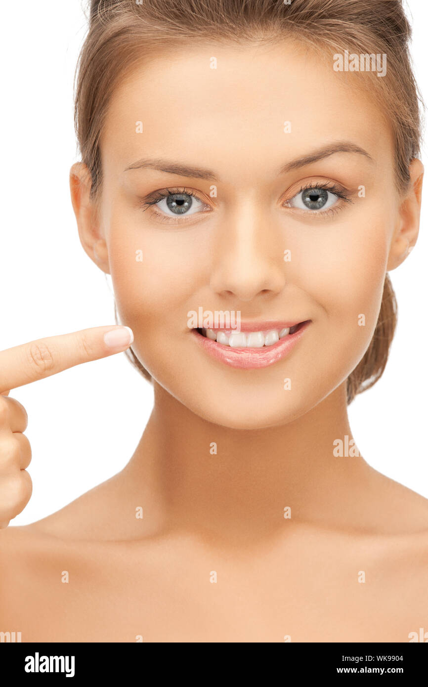 face of beautiful woman showing her teeth Stock Photo - Alamy