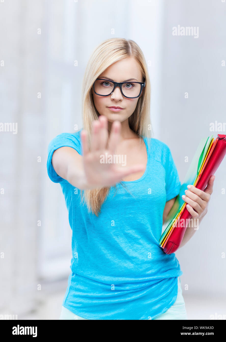 bright picture of young student making stop gesture Stock Photo - Alamy