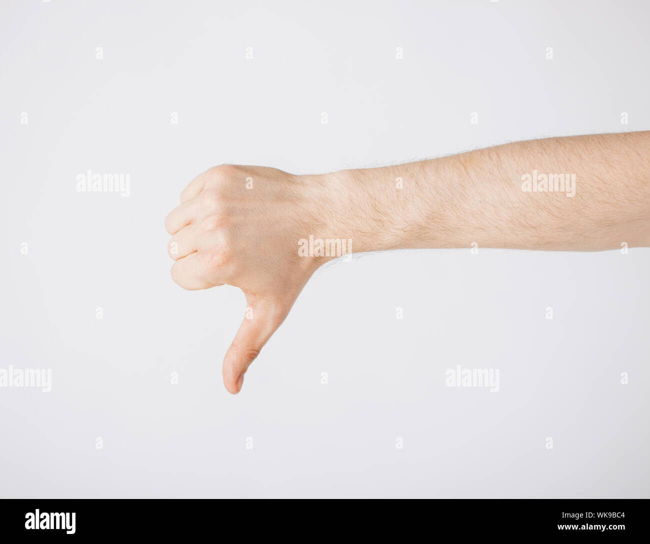 close up of man hand showing thumbs down Stock Photo - Alamy