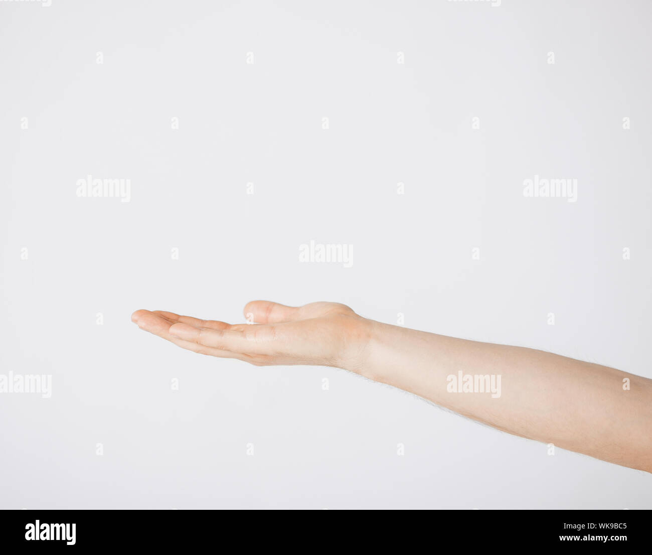 close up of mans hand showing something Stock Photo - Alamy