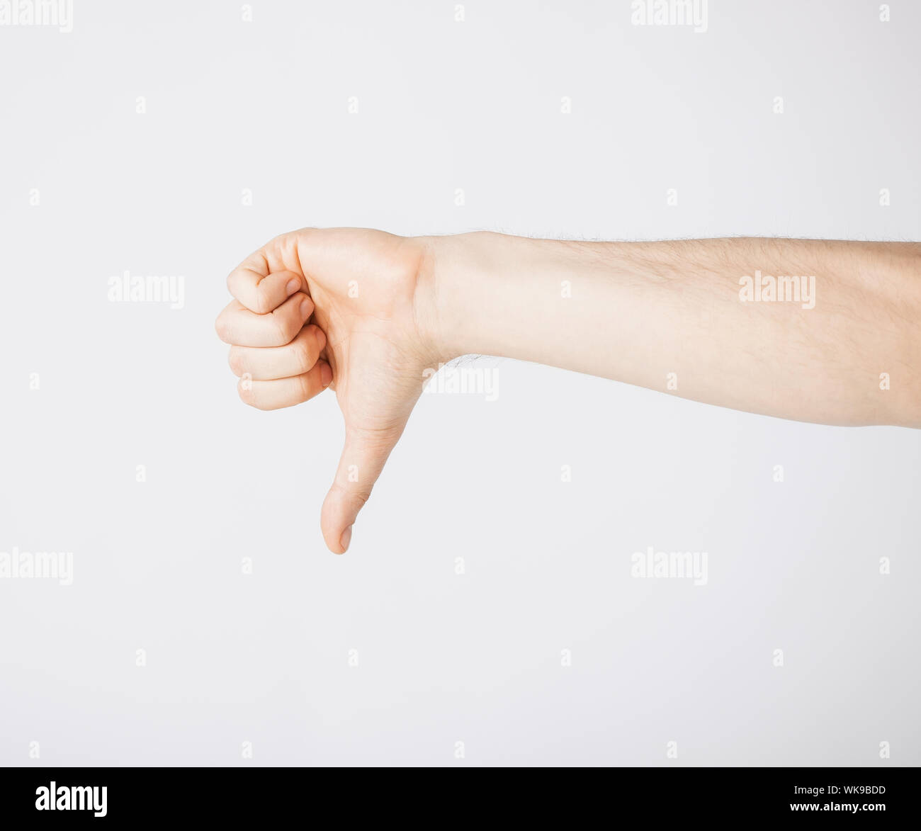 close up of man hand showing thumbs down Stock Photo - Alamy