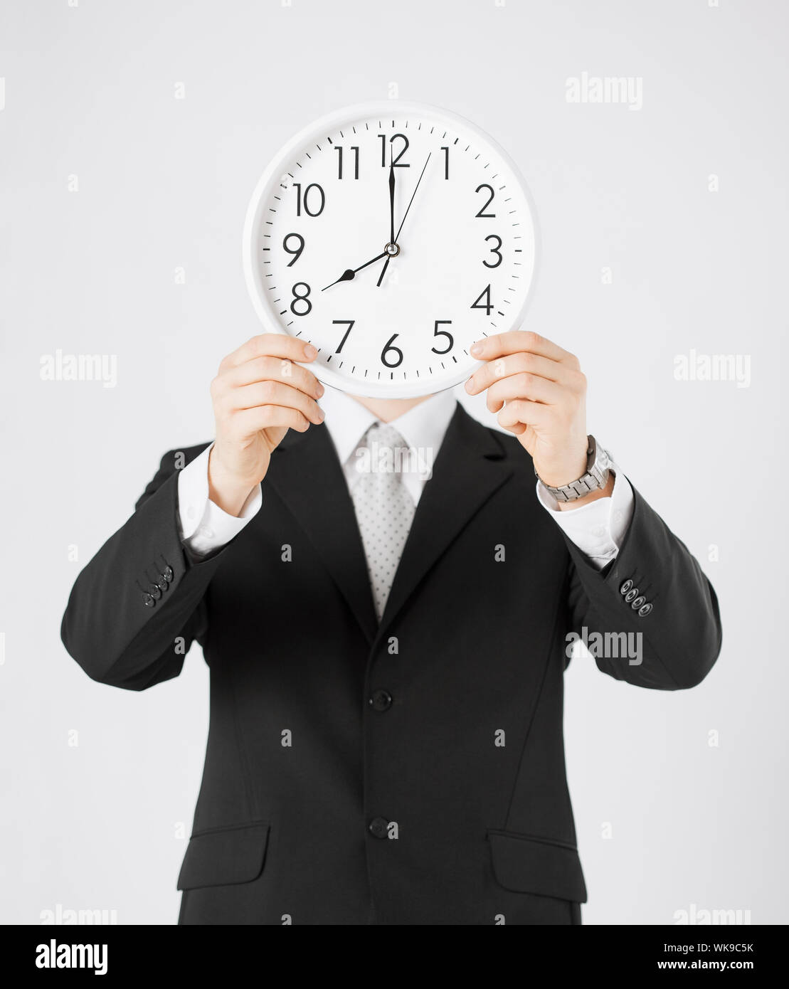 man with wall clock Stock Photo - Alamy