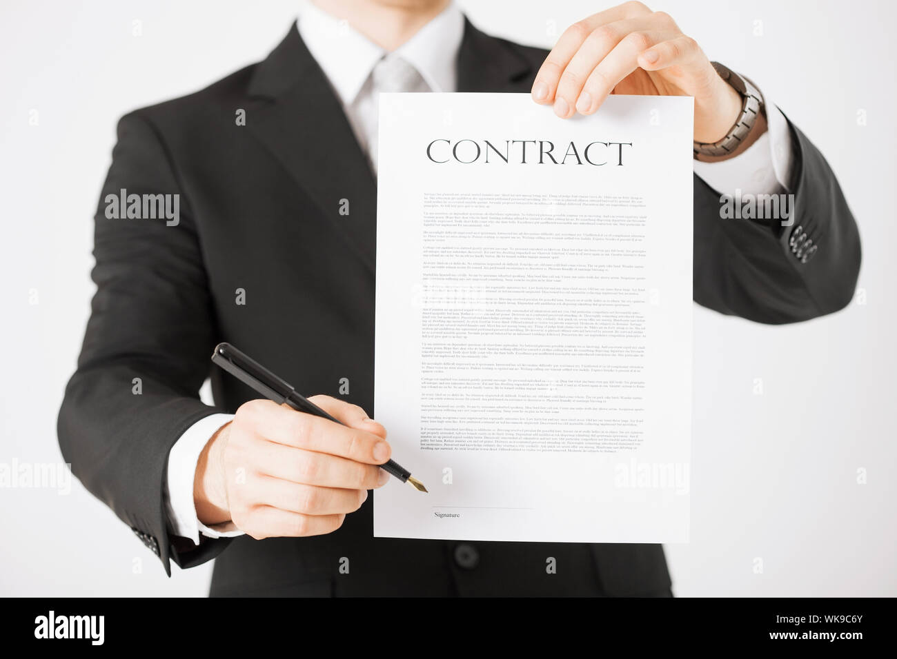 picture of man hands holding contract with random text Stock Photo - Alamy