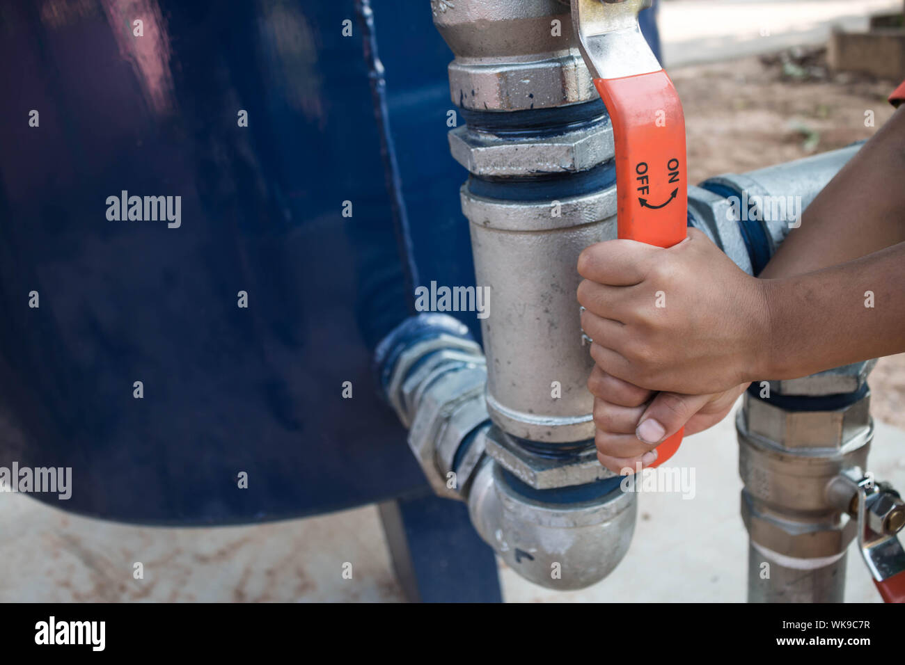 Hands holding pipe hi-res stock photography and images - Alamy