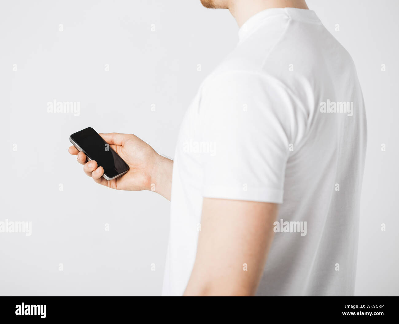 man with smartphone typing something Stock Photo - Alamy
