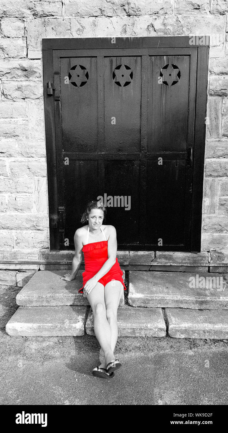 Person sitting on doorstep hi-res stock photography and images - Alamy
