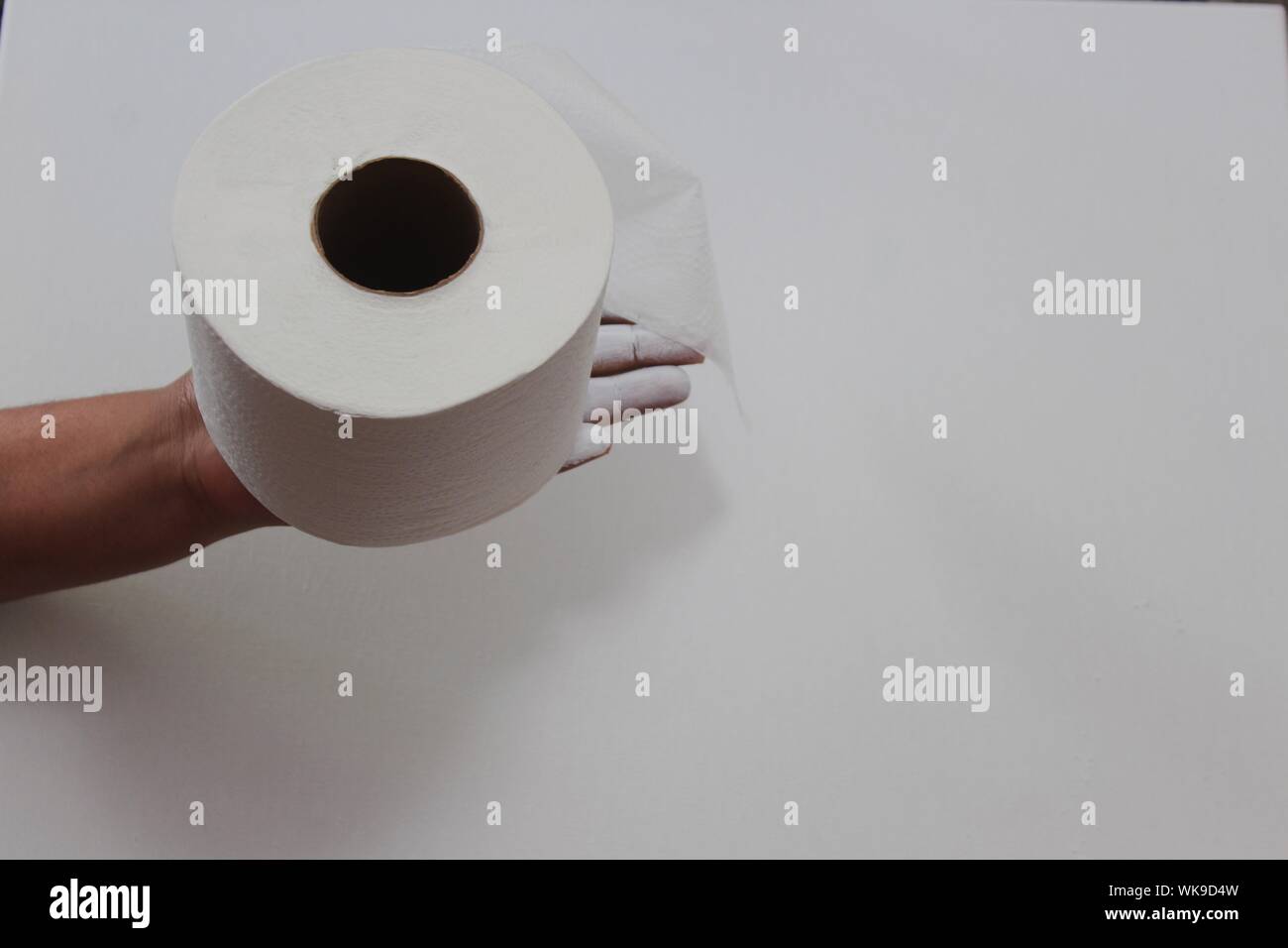 Hand on toilet paper hi-res stock photography and images - Alamy