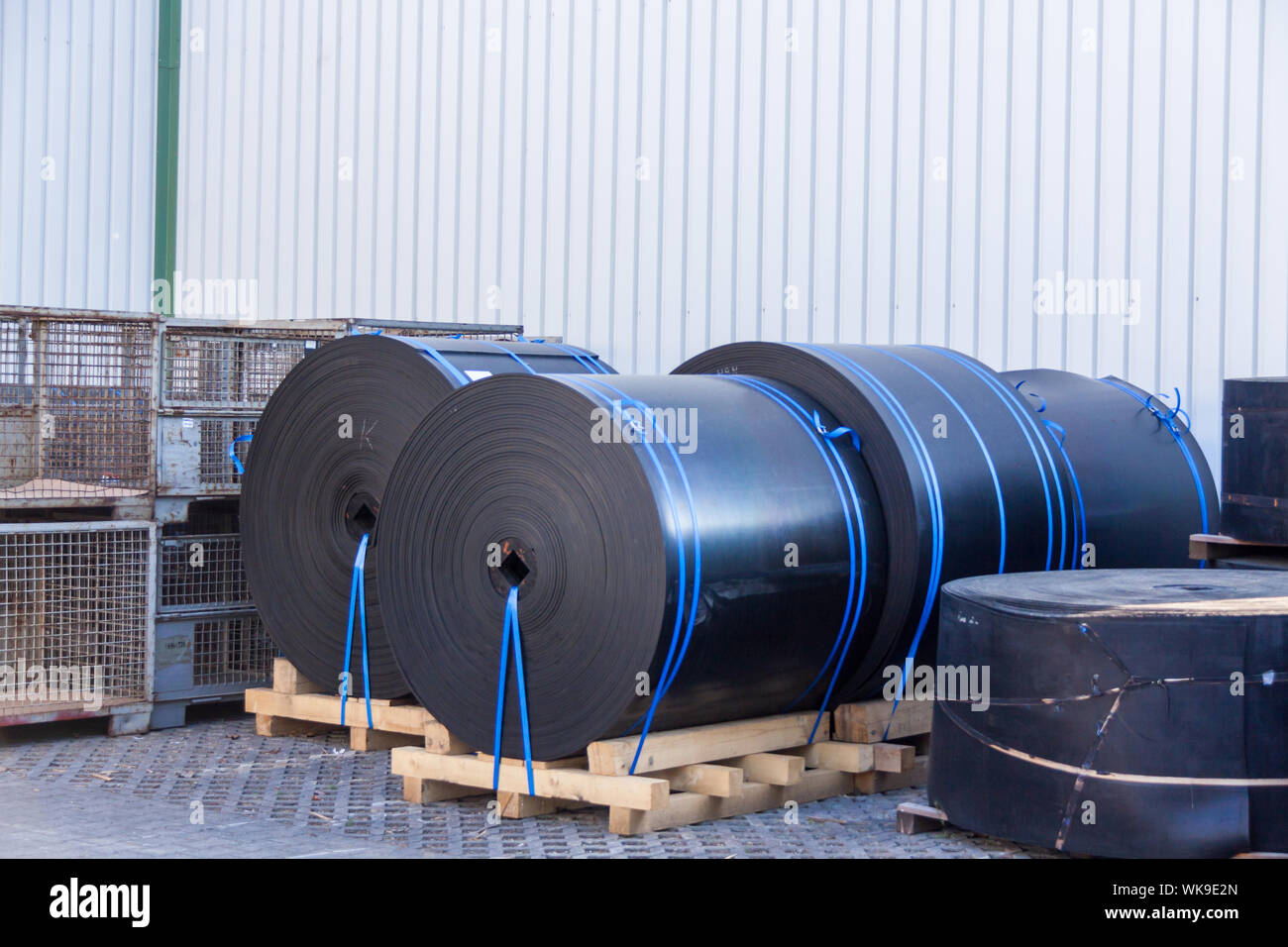 Rolls of black industrial plastic Stock Photo - Alamy