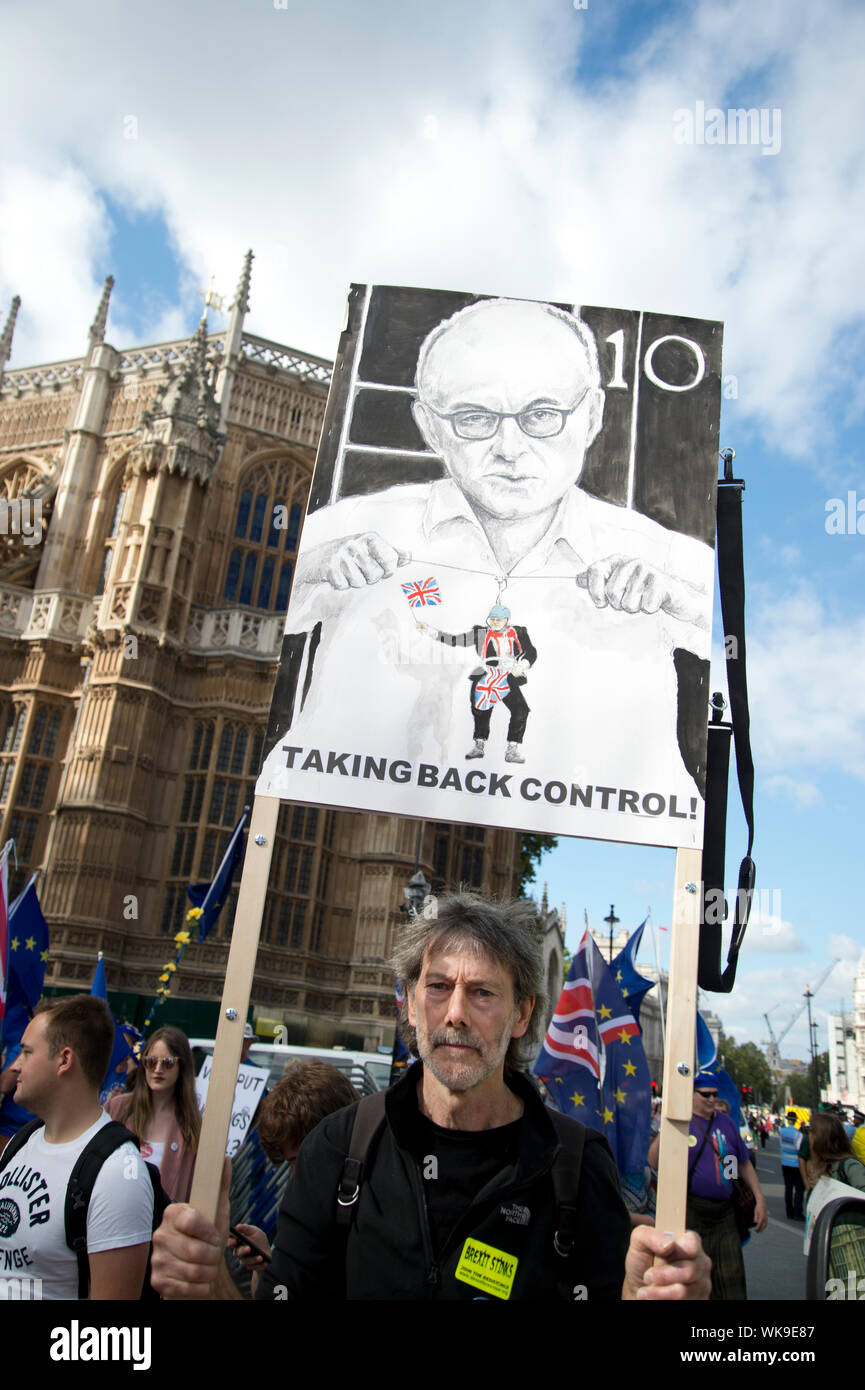 Protest in Parliament Square. An artist with his drawing of Dominic ...
