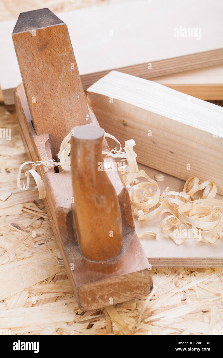 Handheld wood plane with wood shavings Stock Photo - Alamy