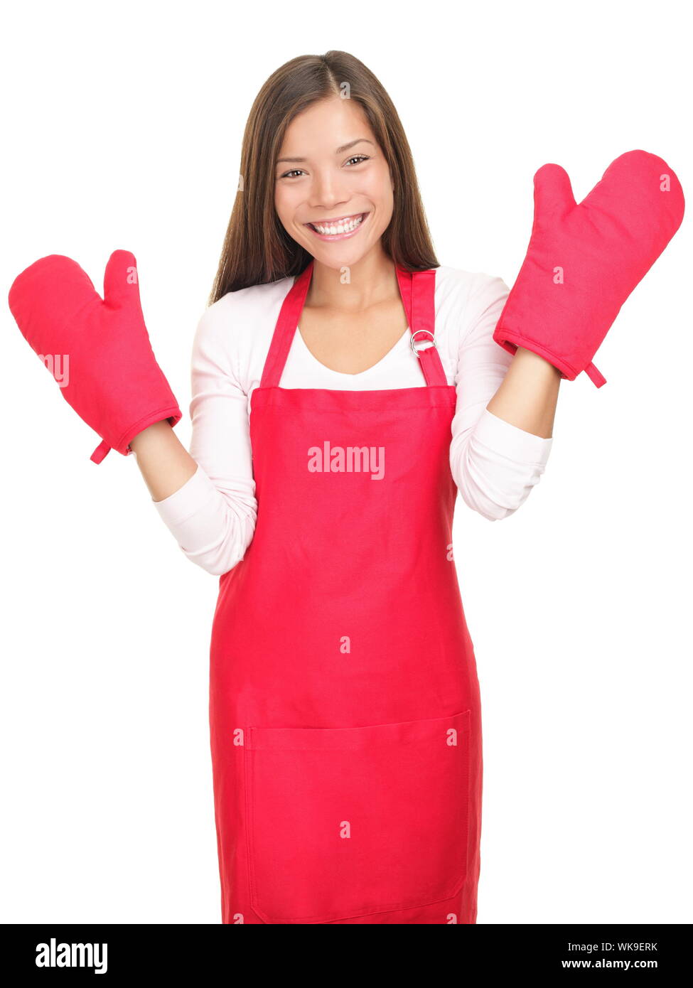 Cute smiling young housewife with cooking mittens isolated Stock Photo ...