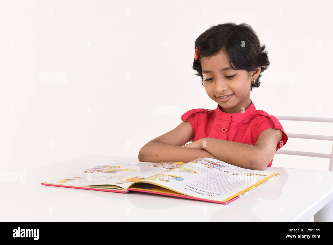 Girl reading a book Stock Photo - Alamy