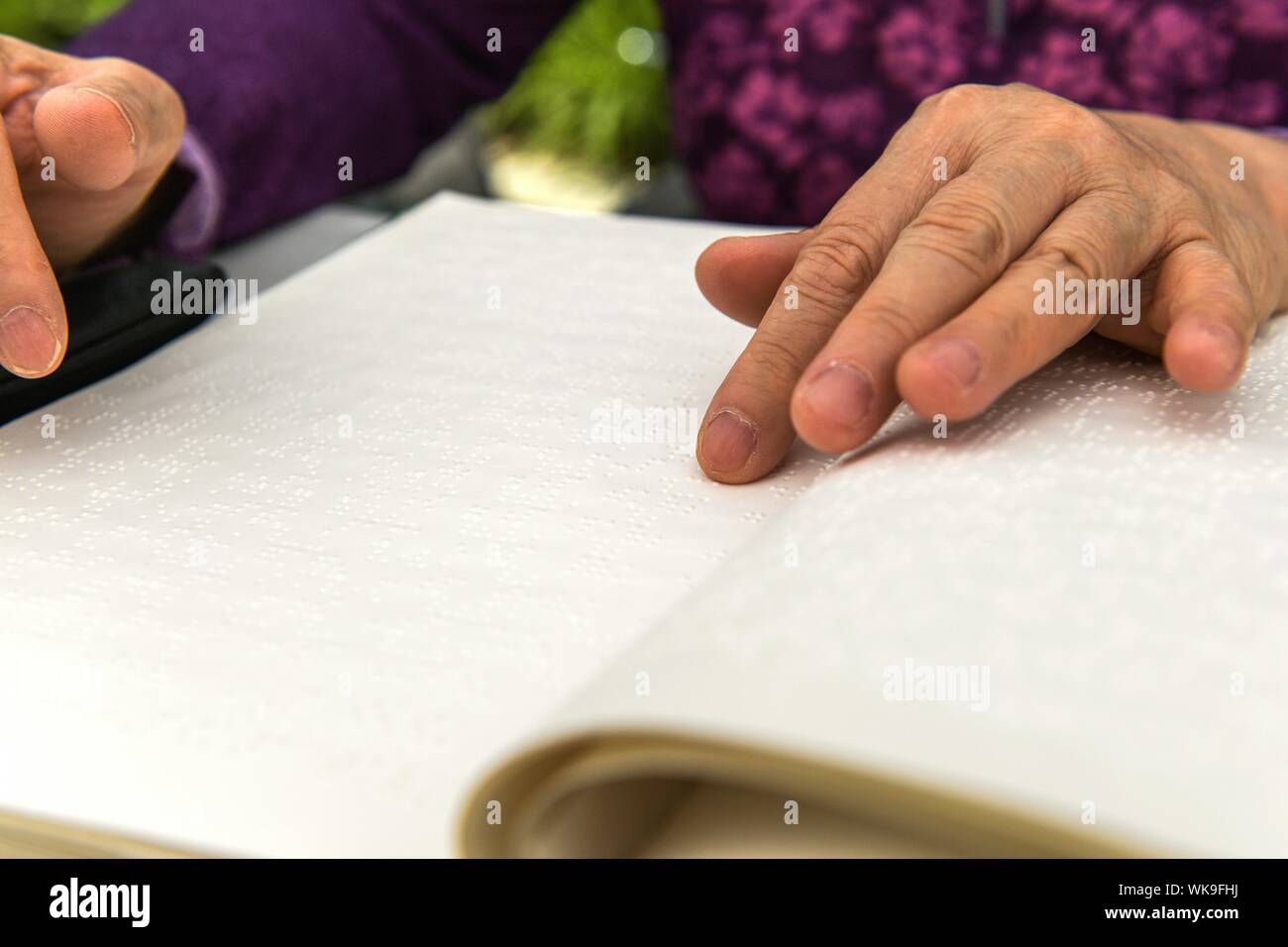 Braille with finger hi-res stock photography and images - Alamy