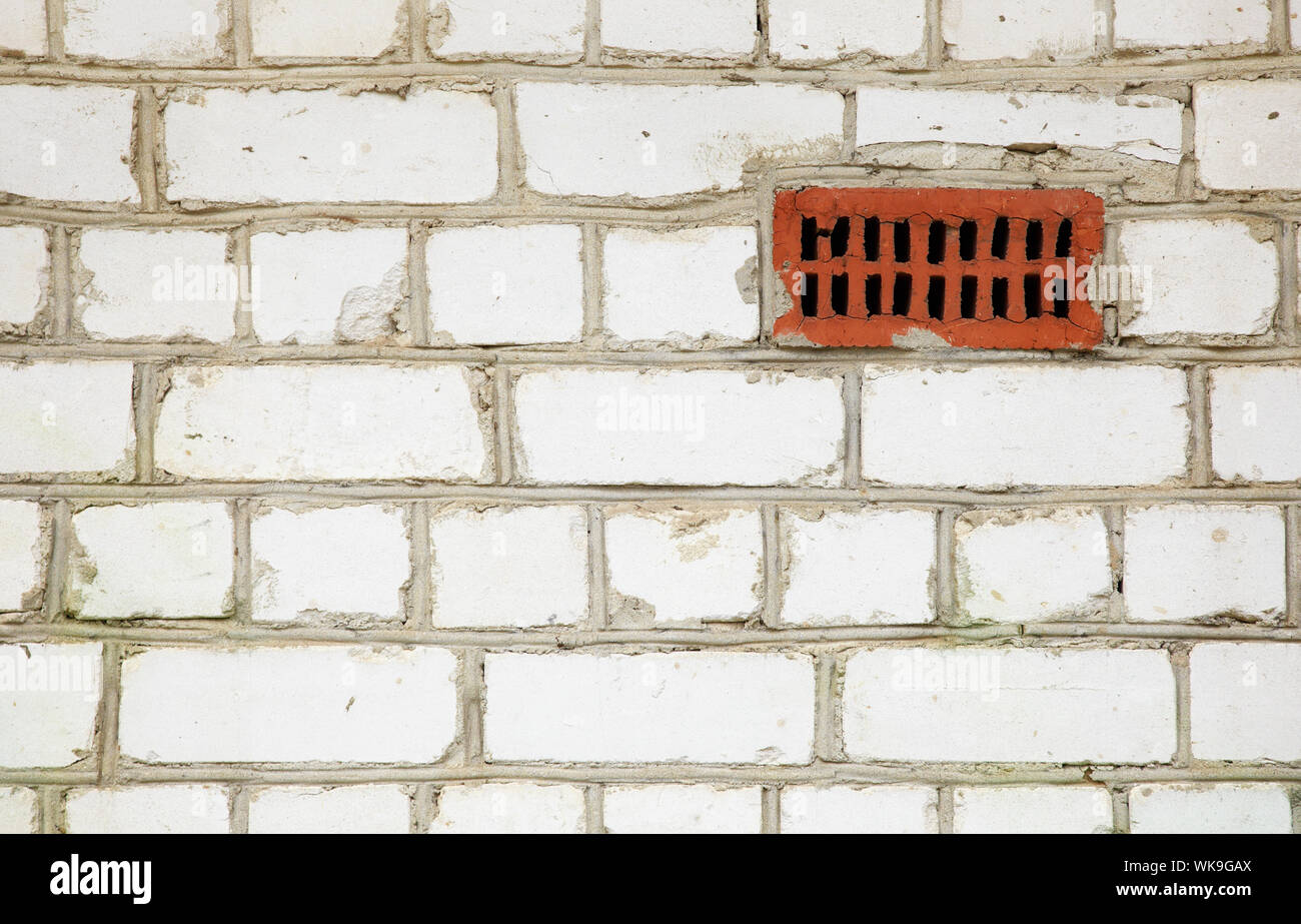 White brick wall with primitive ventilation system Stock Photo - Alamy