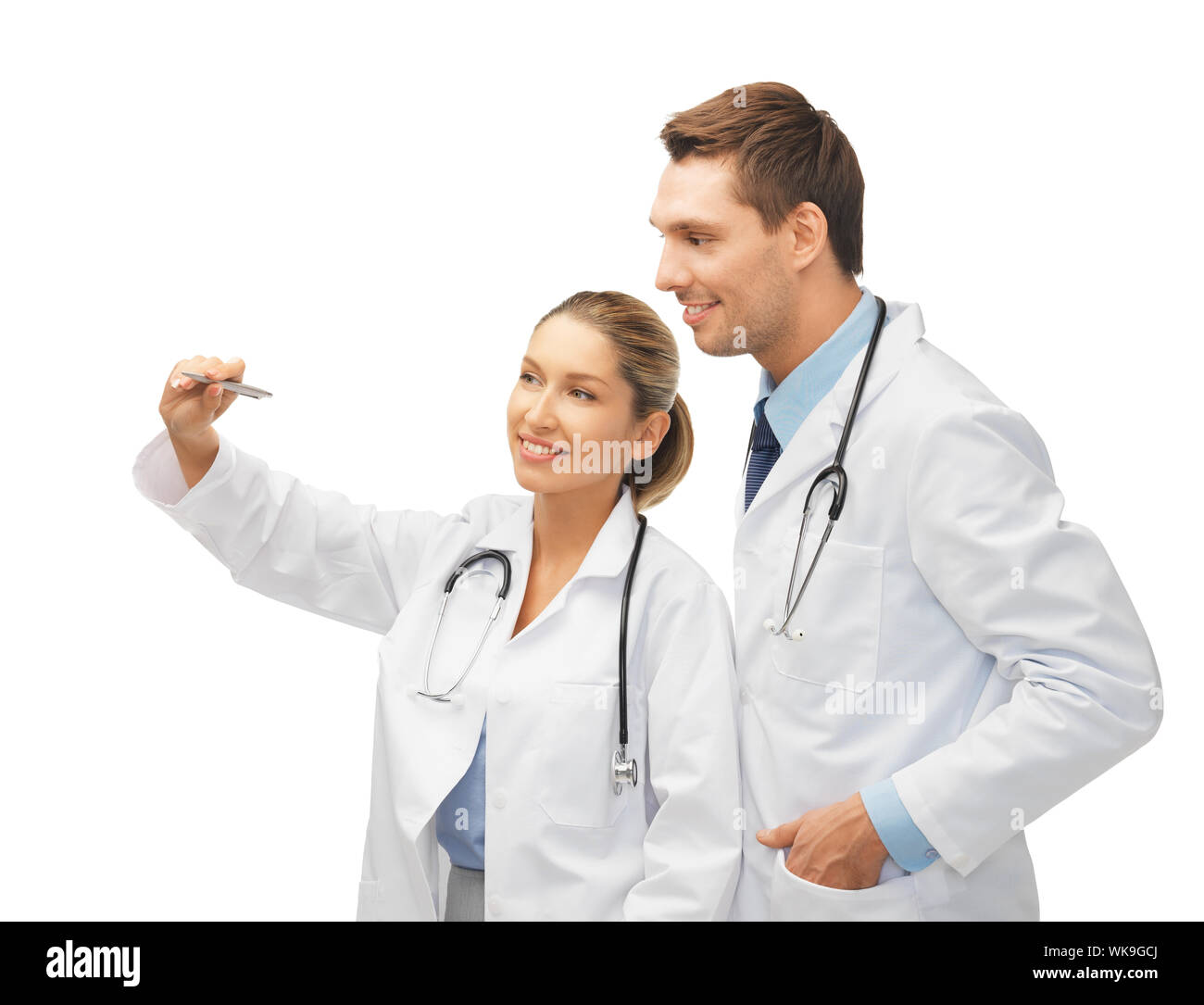 two young doctors working with something imaginary Stock Photo - Alamy