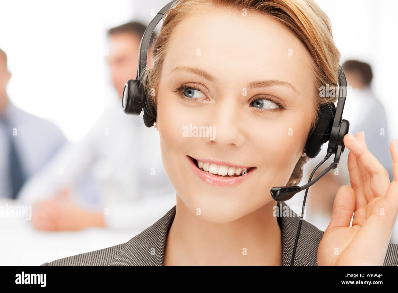 bright picture of friendly female helpline operator Stock Photo - Alamy