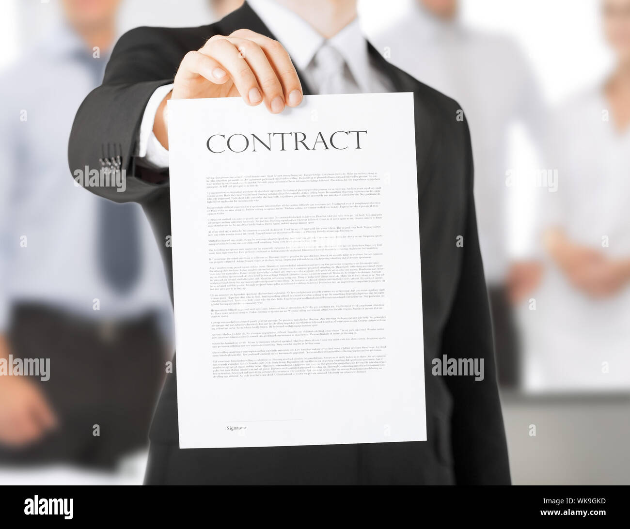 picture of man hands holding contract with random text Stock Photo - Alamy