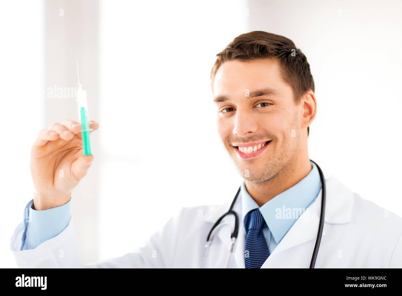 male doctor holding syringe with injection Stock Photo - Alamy