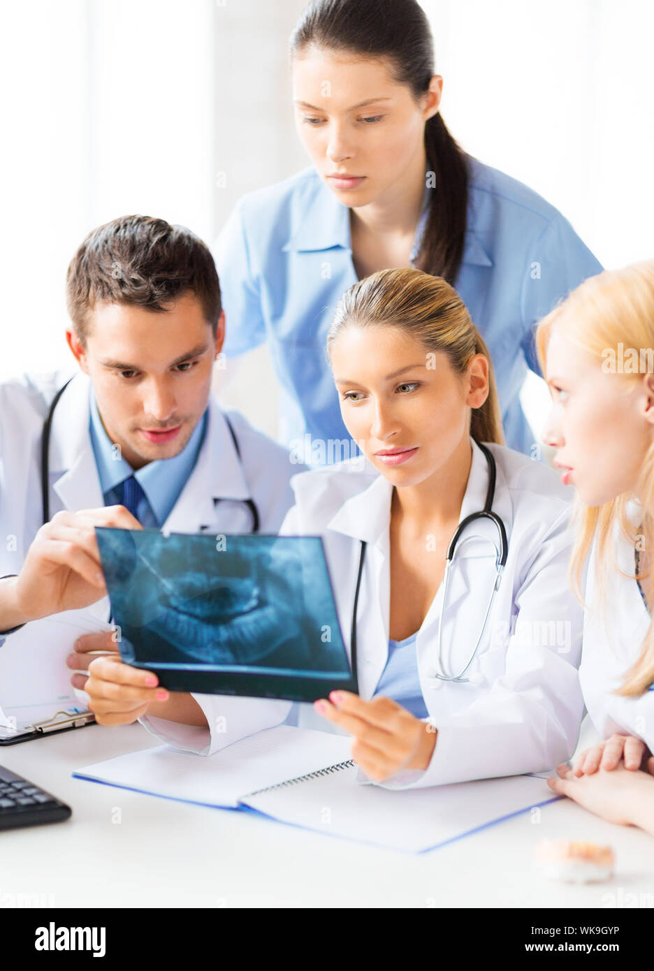 young group of doctors looking at x-ray Stock Photo - Alamy