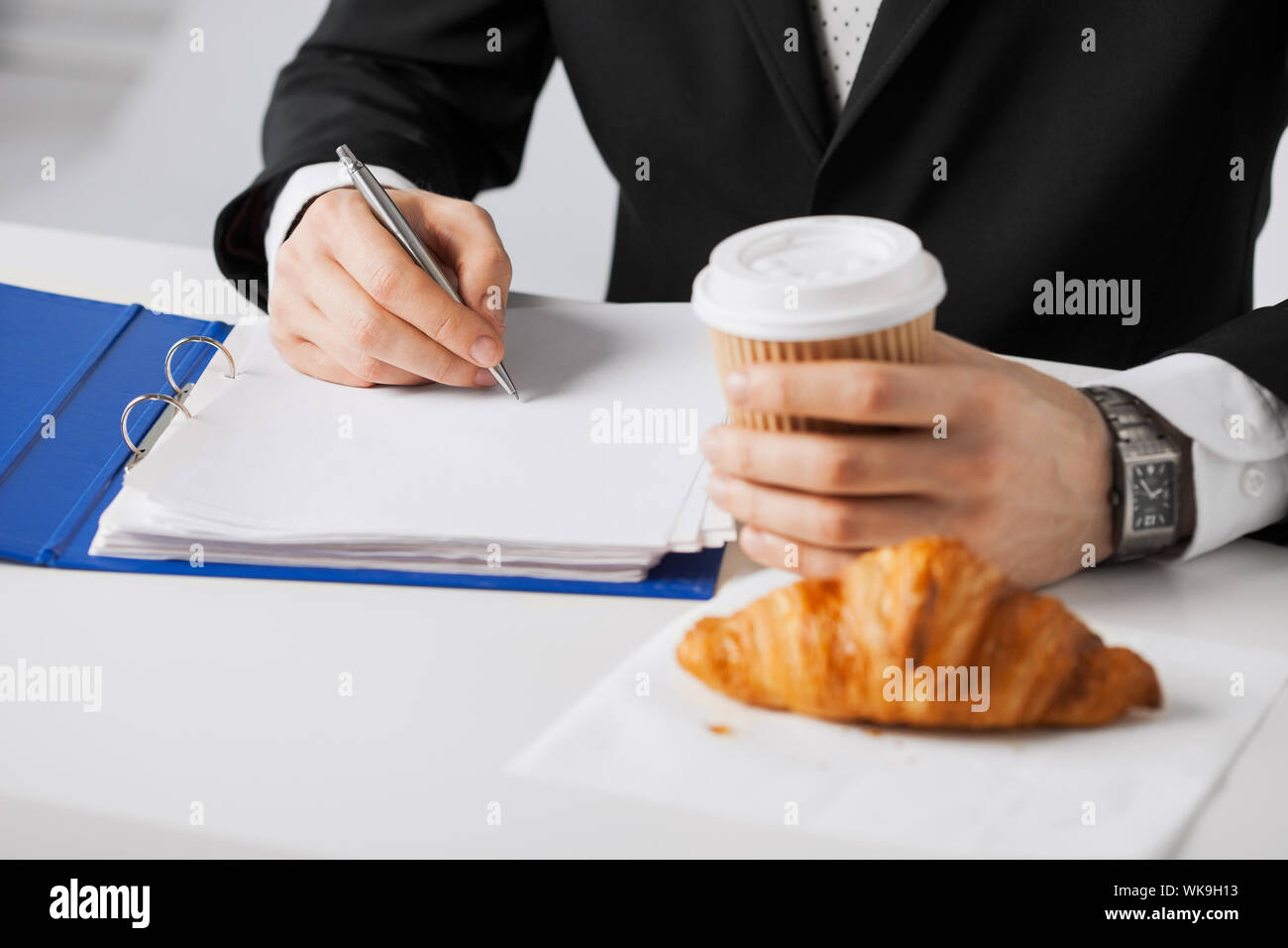businessman on his coffee break making notes Stock Photo - Alamy