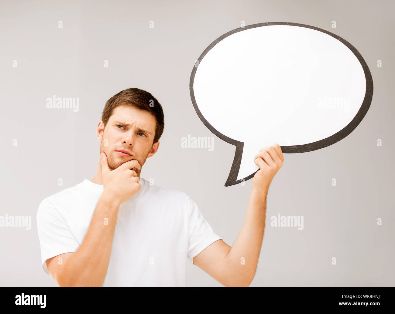 young man with blank text bubble Stock Photo - Alamy