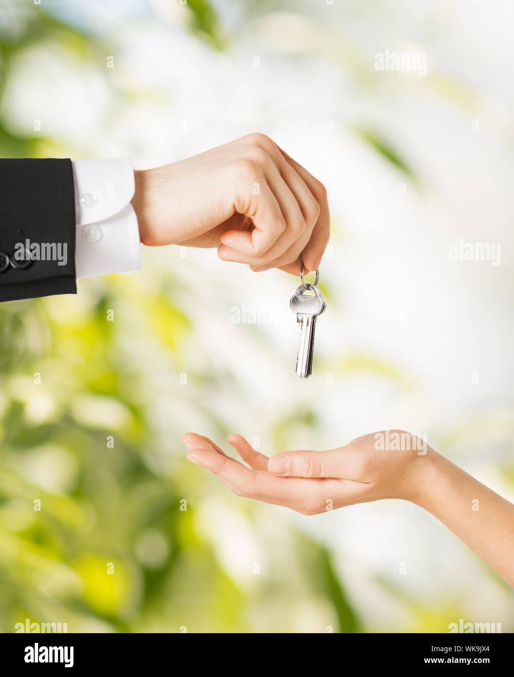 picture of man hand passing house keys to woman Stock Photo - Alamy