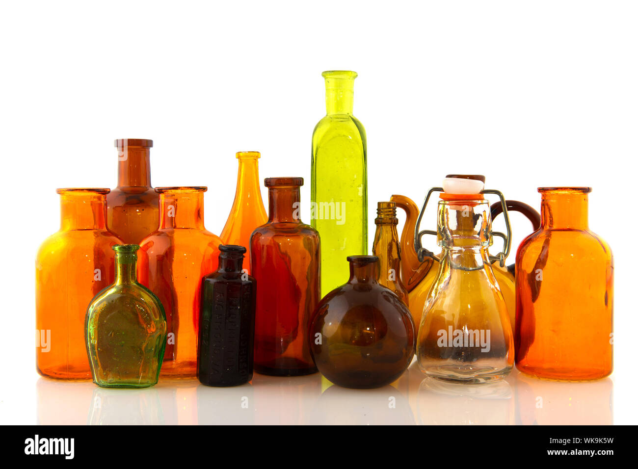 Several glass objects in a row isolated over white Stock Photo - Alamy