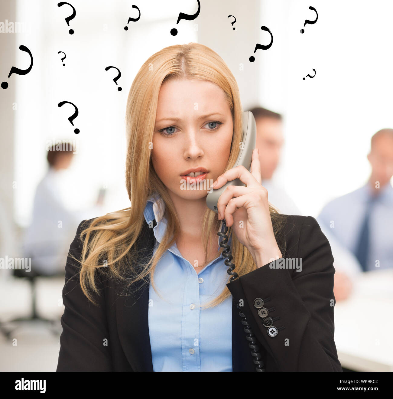 confused woman with phone in office Stock Photo - Alamy