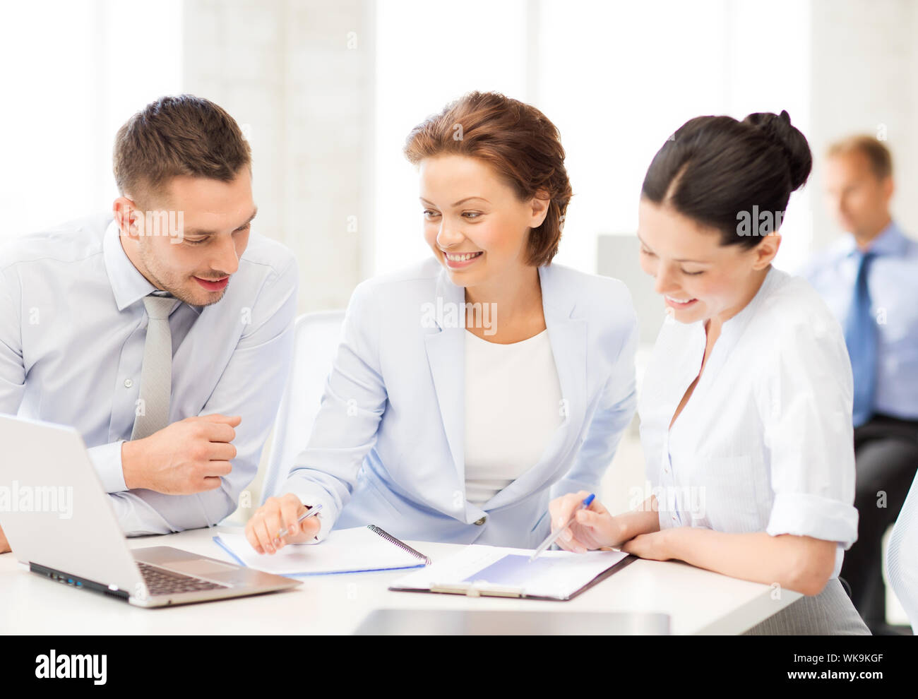 Business colleagues discussing common hi-res stock photography and ...