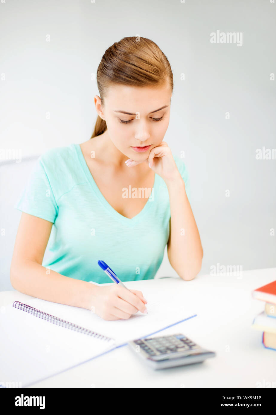 picture of student girl with notebook and calculator Stock Photo - Alamy