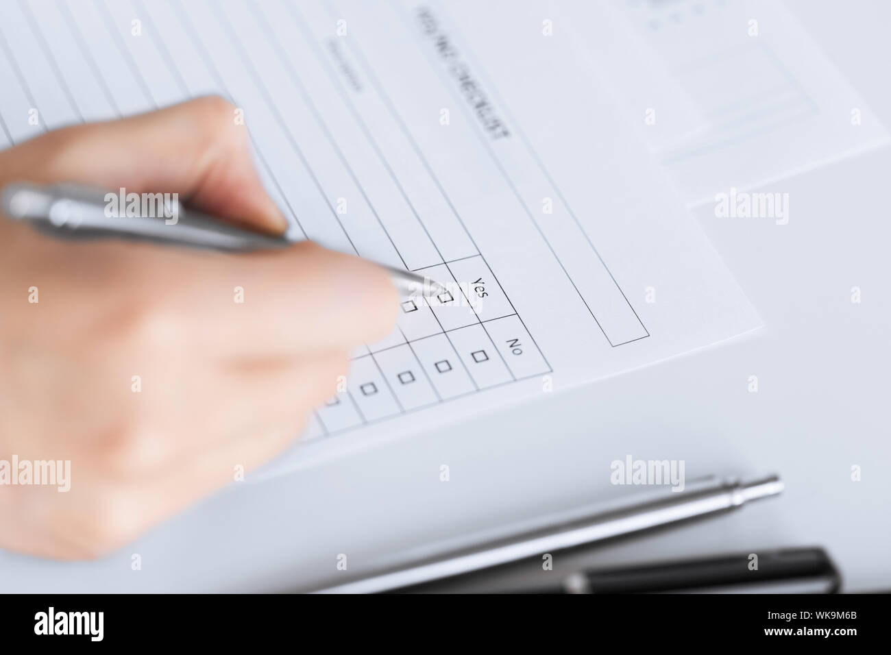 close up of woman hand with blank questionnaire or form Stock Photo - Alamy