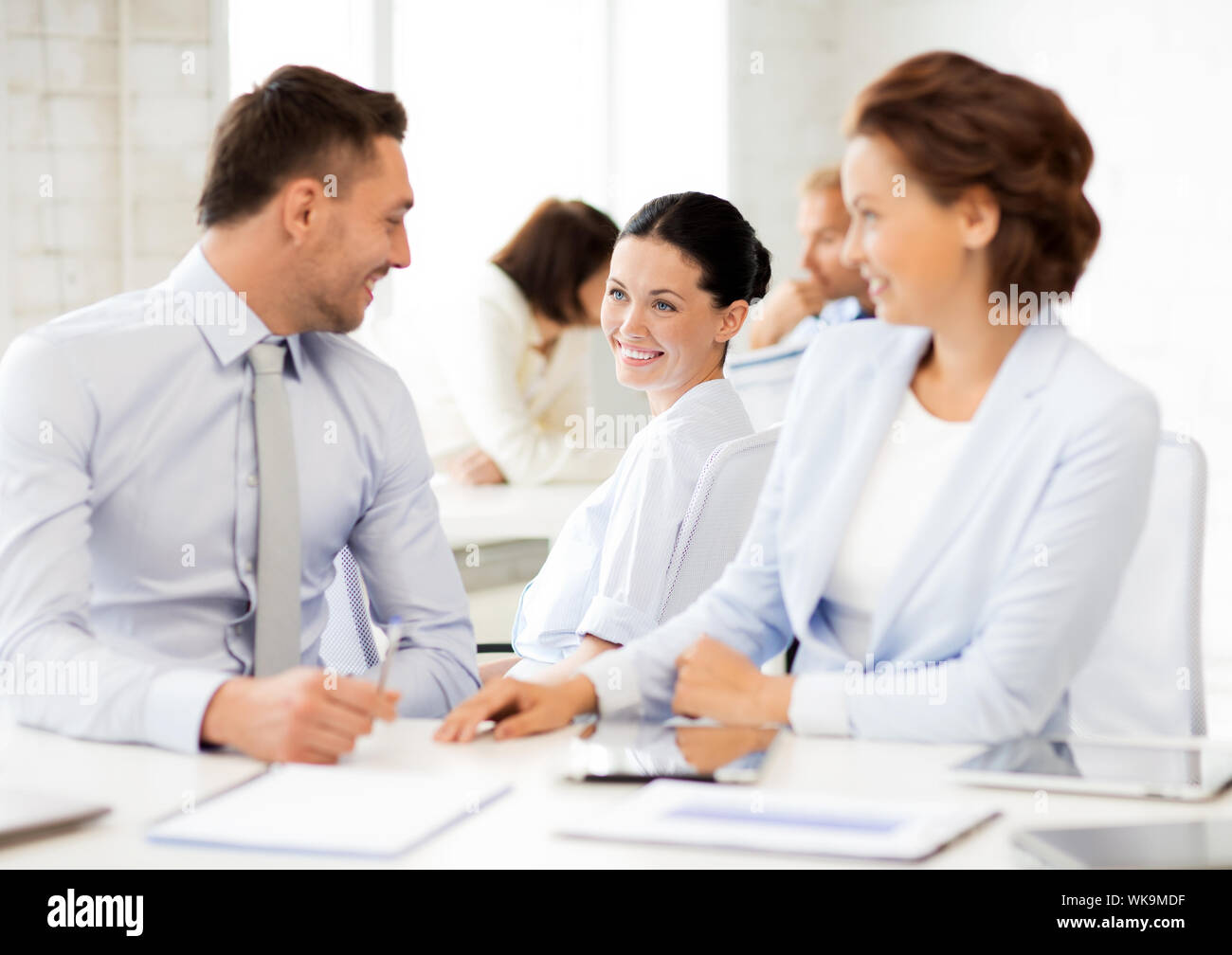 Business colleagues discussing common hi-res stock photography and ...