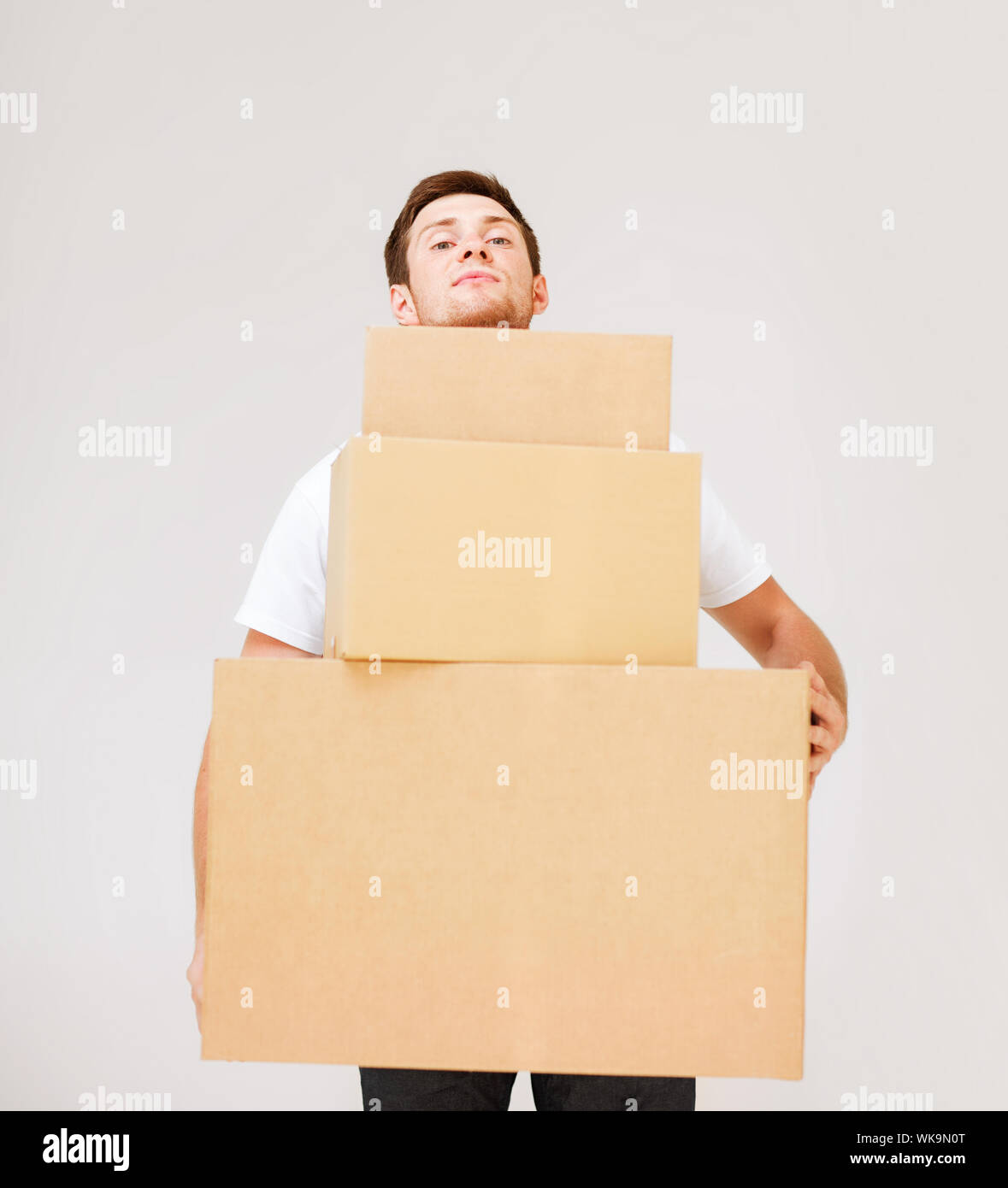 picture of young man carrying carton boxes Stock Photo - Alamy