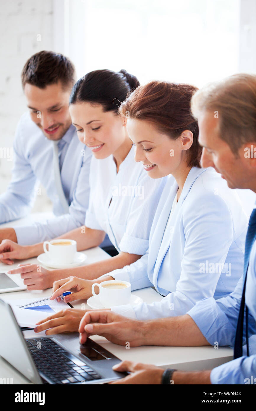group of people working with laptops in office Stock Photo - Alamy
