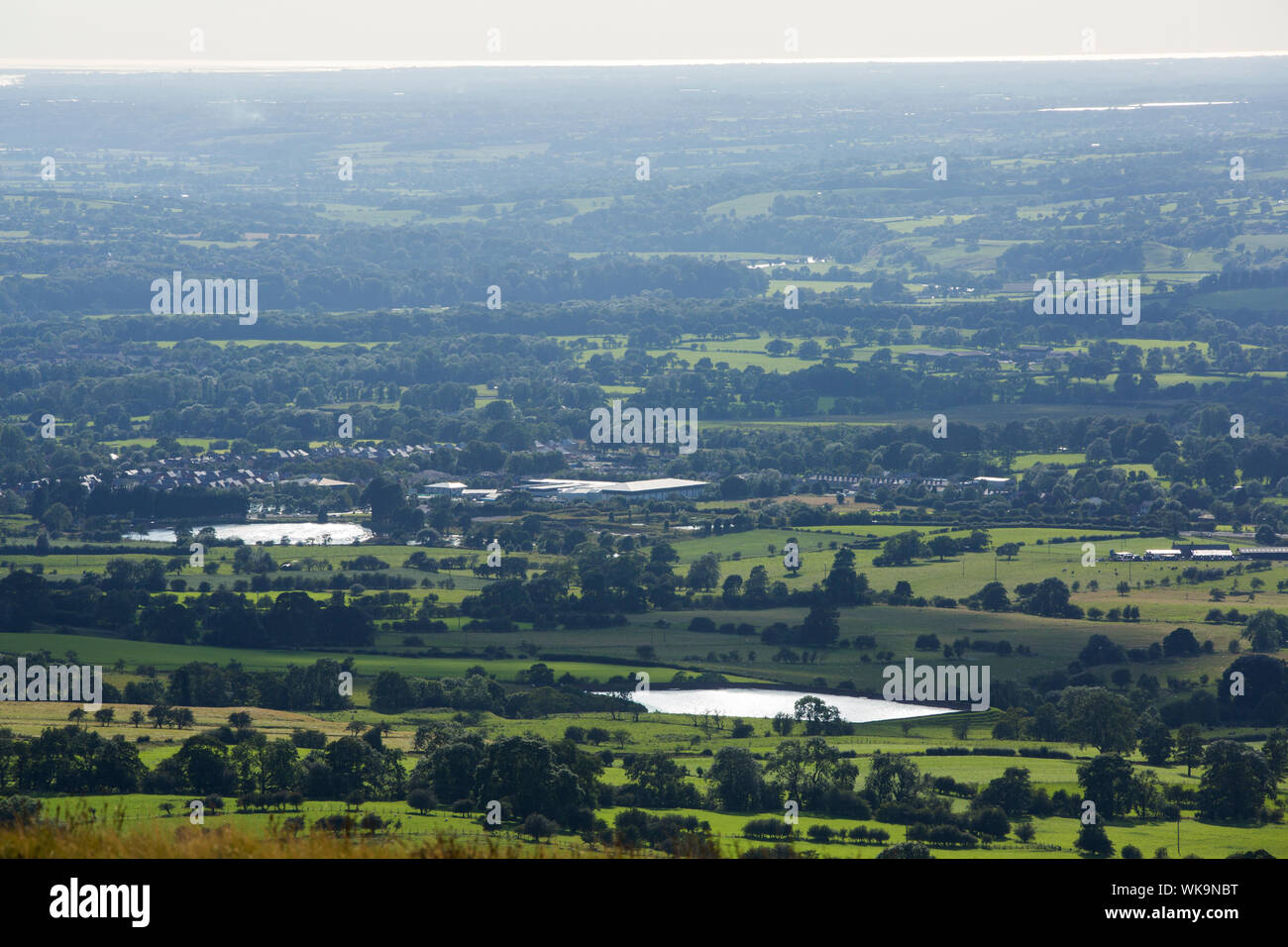 Looking down the Ribble Valley from Pendle Hill across Barrow ponds and ...