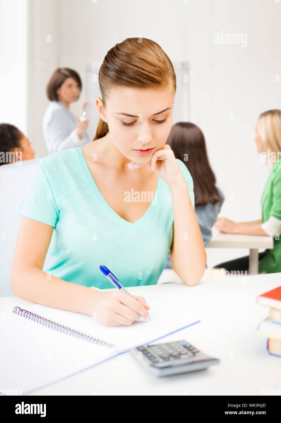 student girl with notebook and calculator Stock Photo - Alamy