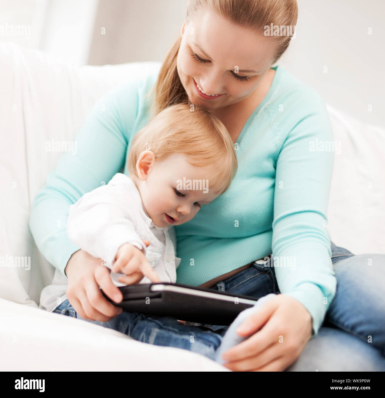 mother and adorable baby with tablet pc Stock Photo - Alamy