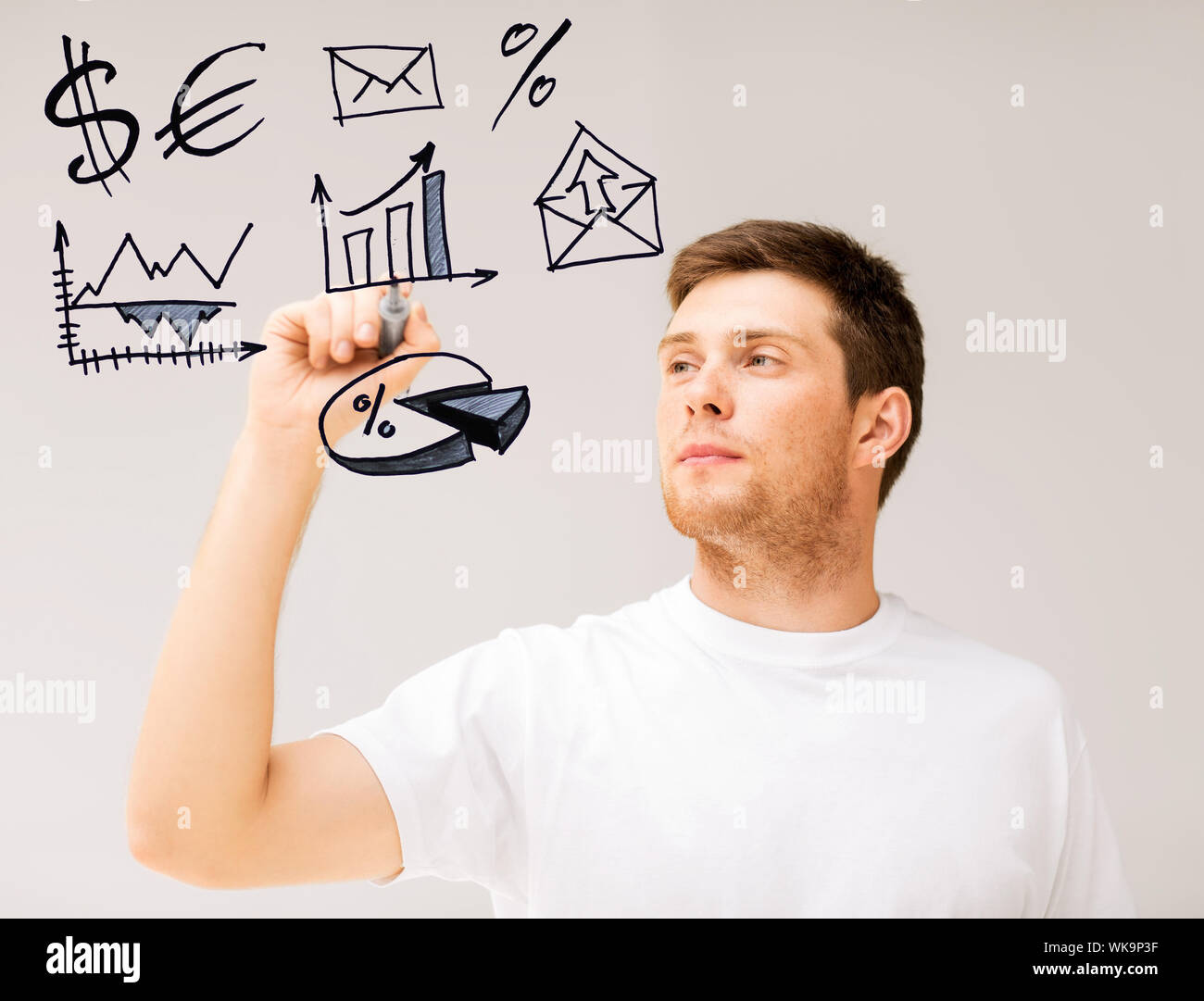 Young businessman drawing icons hi-res stock photography and images - Alamy
