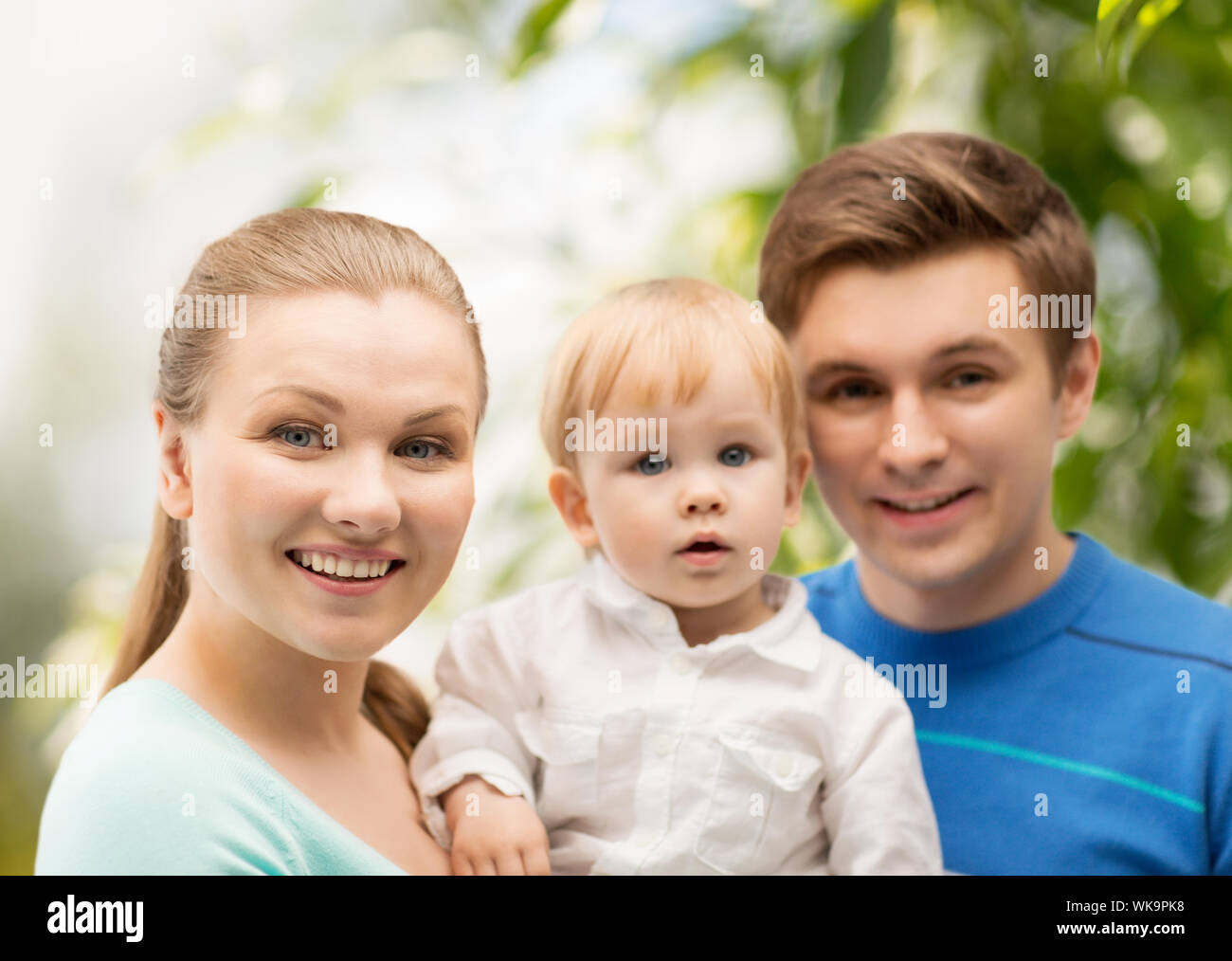 family, parenting and child care concept - happy family with adorable ...