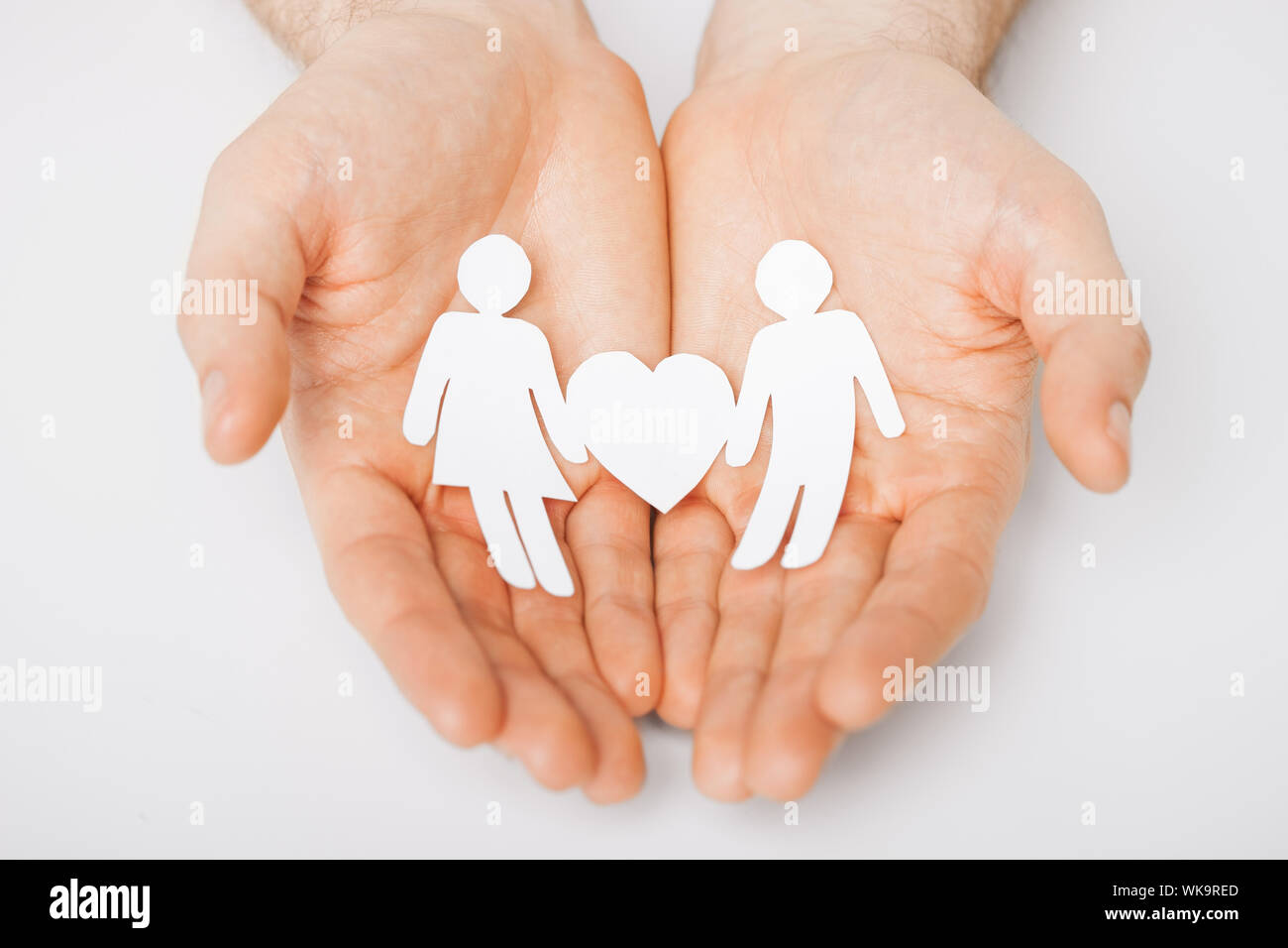man hands with paper men Stock Photo - Alamy