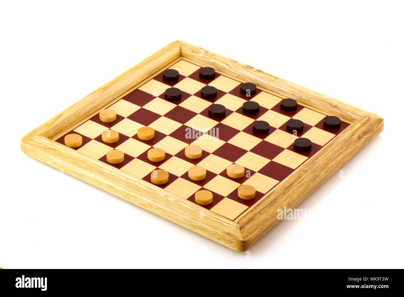 Playing checkers with wooden black and white pawns Stock Photo - Alamy