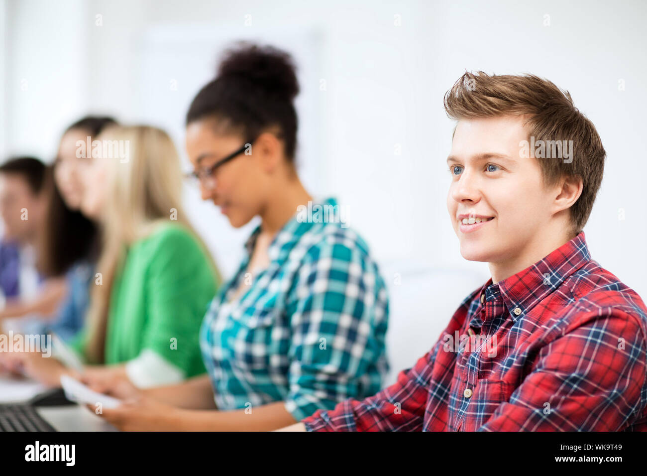 education concept - student with computer studying at school Stock ...