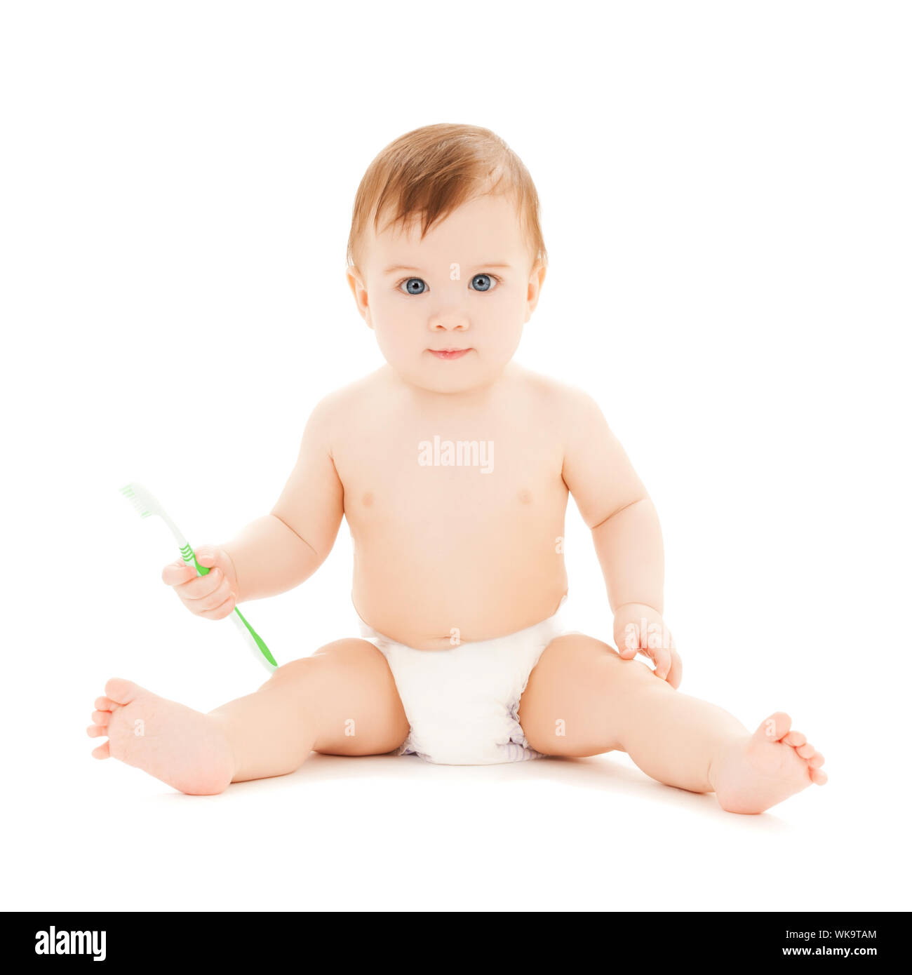 curious baby brushing teeth Stock Photo - Alamy