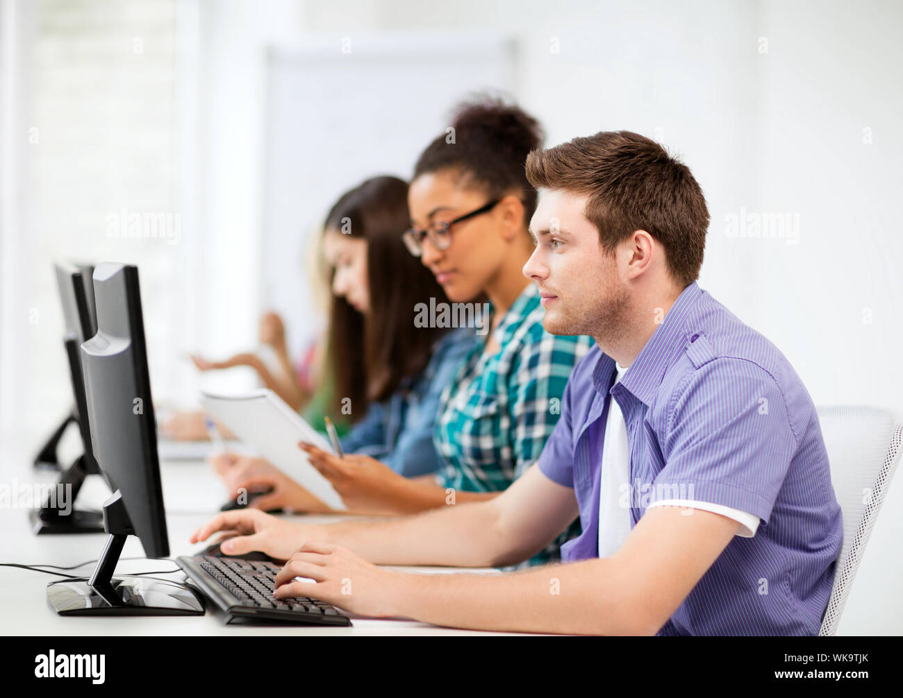 education concept - student with computers studying at school Stock ...