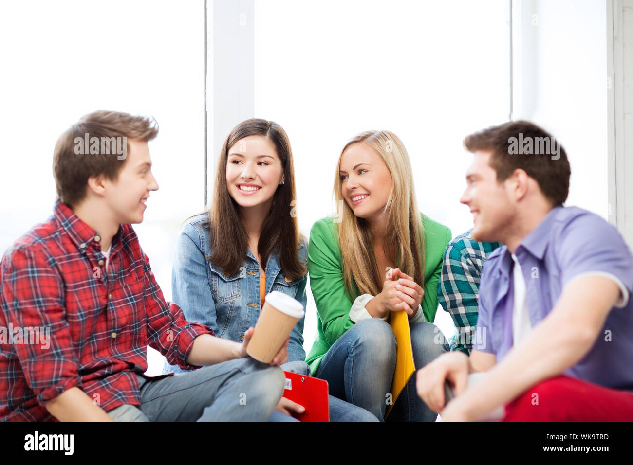 education concept - students communicating and laughing at school Stock ...