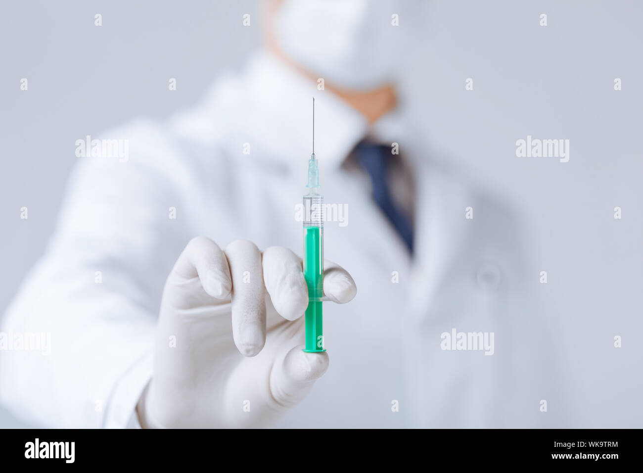 male doctor holding syringe with injection Stock Photo - Alamy