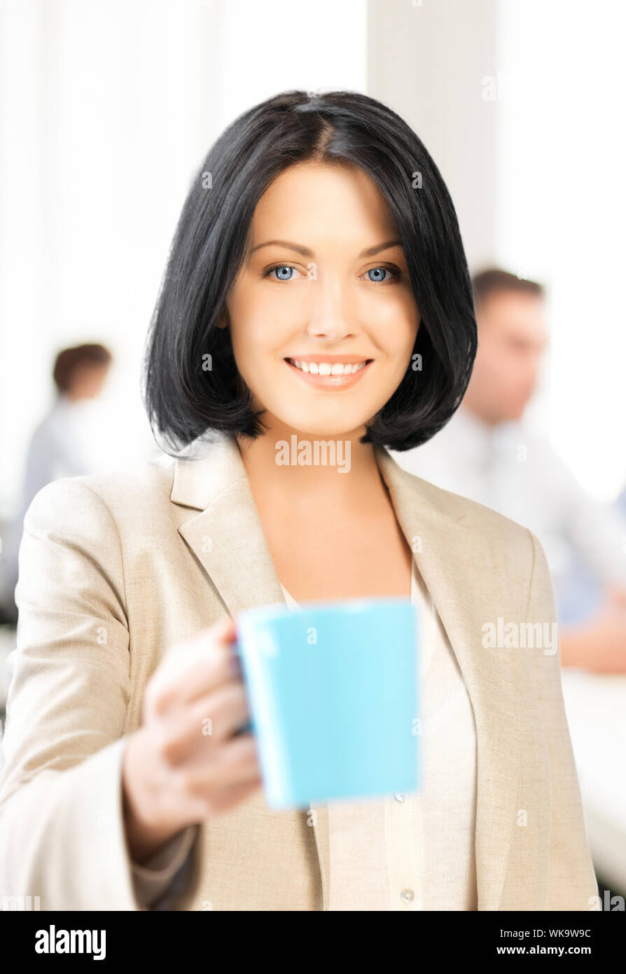 Lady drinking tea at office team hi-res stock photography and images ...